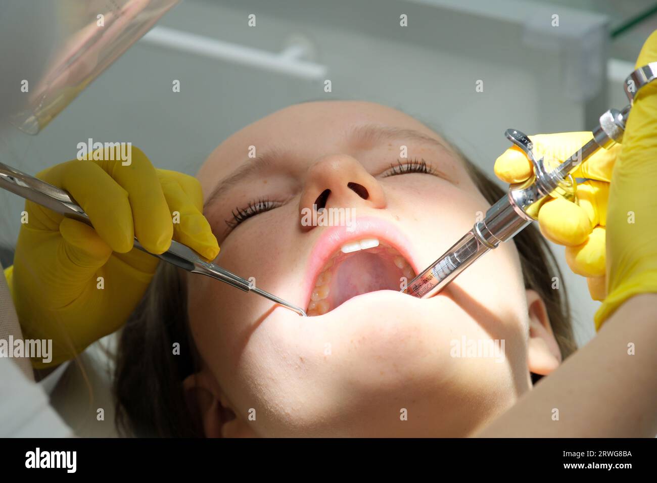 dental clinic, dental treatment, pain relief, giving an injection with ...