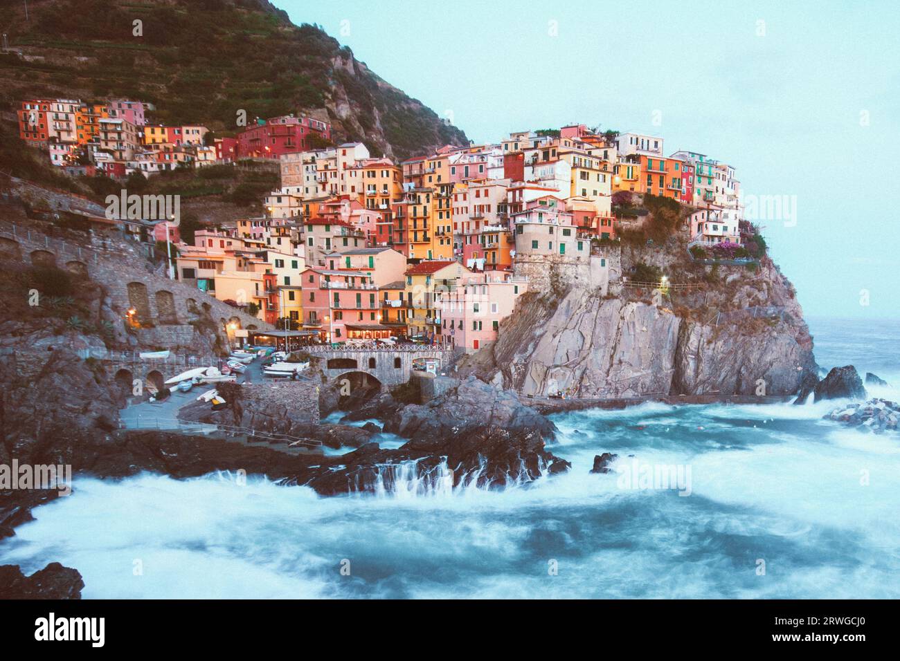 Manarola fisherman village in a dramatic wind storm. Manarola is one of ...
