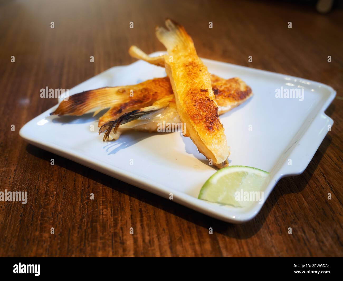 Fried salmon belly belly on white plate. Japanese cuisine Stock Photo ...