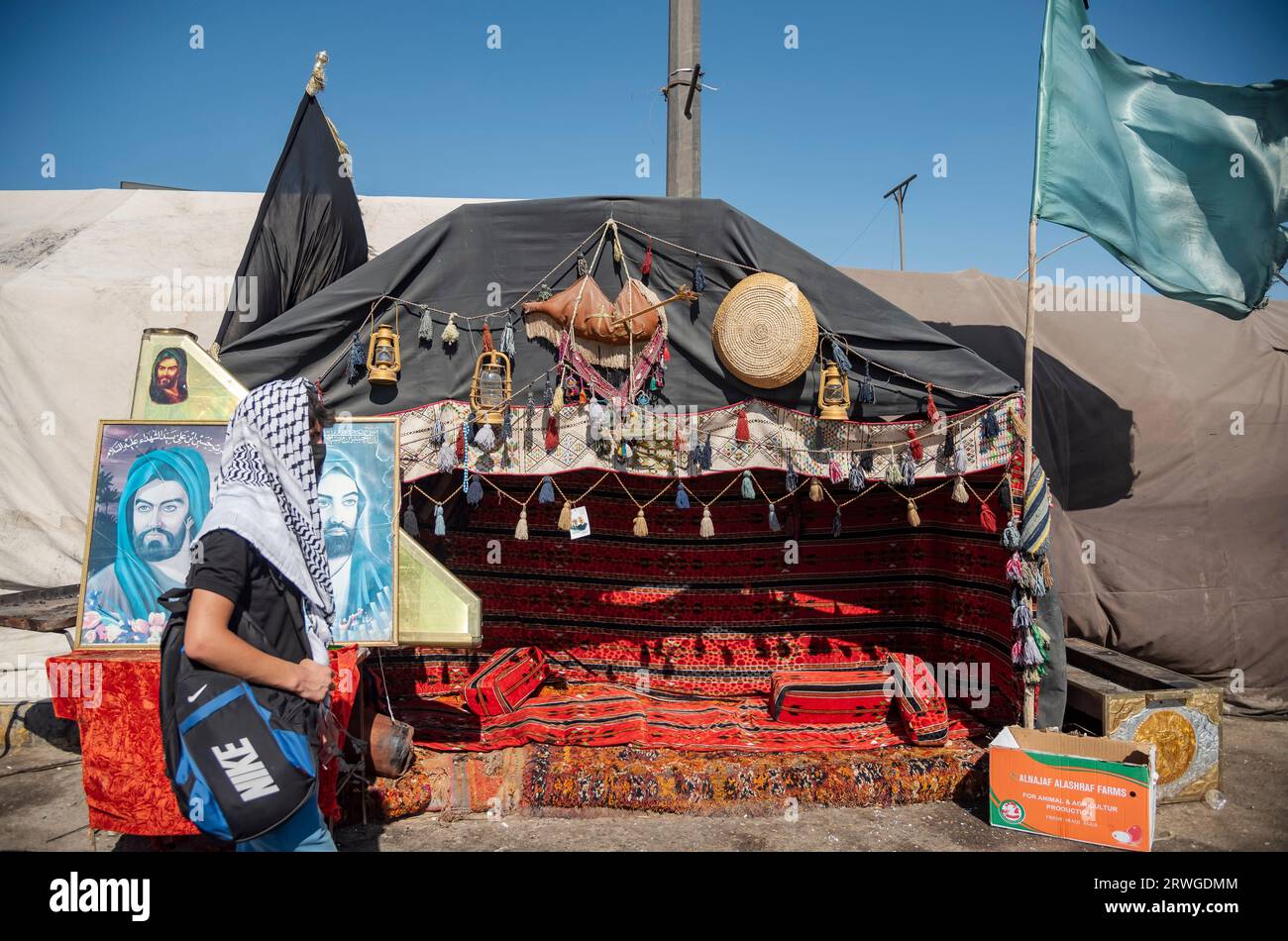 A man walk Infront of a Mokab (resting place), marching from Najaf ...