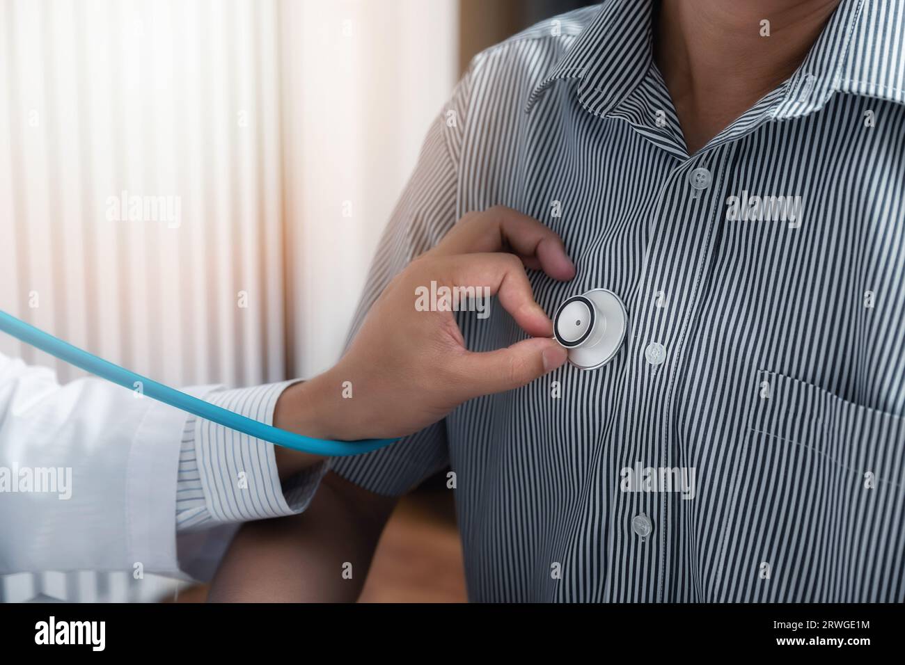 Doctor Checking Patient With Stethoscope. Doctor listening to patient ...