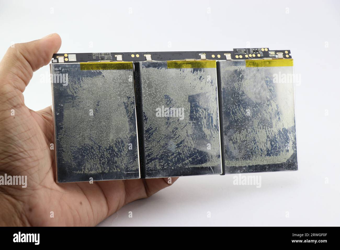 Pack of lithium polymer batteries held in the hand. Lithium-ion ...