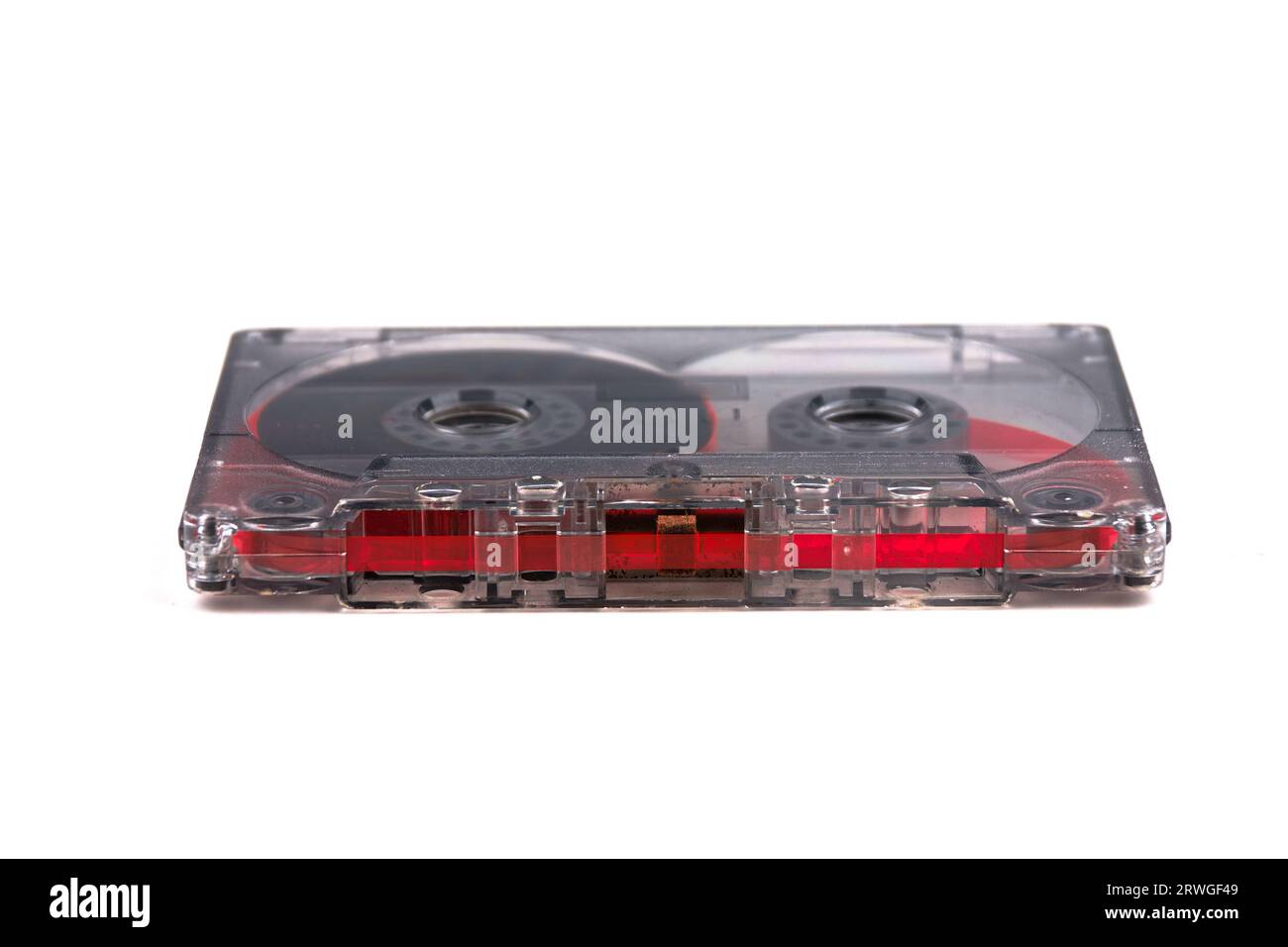 vintage analog audio cassette with transparent case and visible tape ...