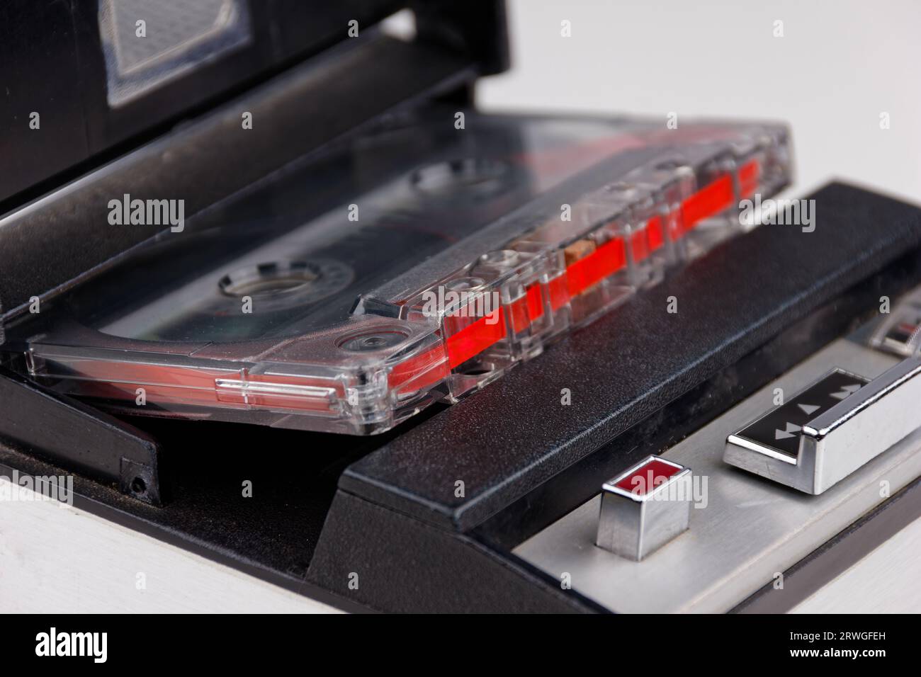 vintage analog audio cassette with transparent case and visible tape ...
