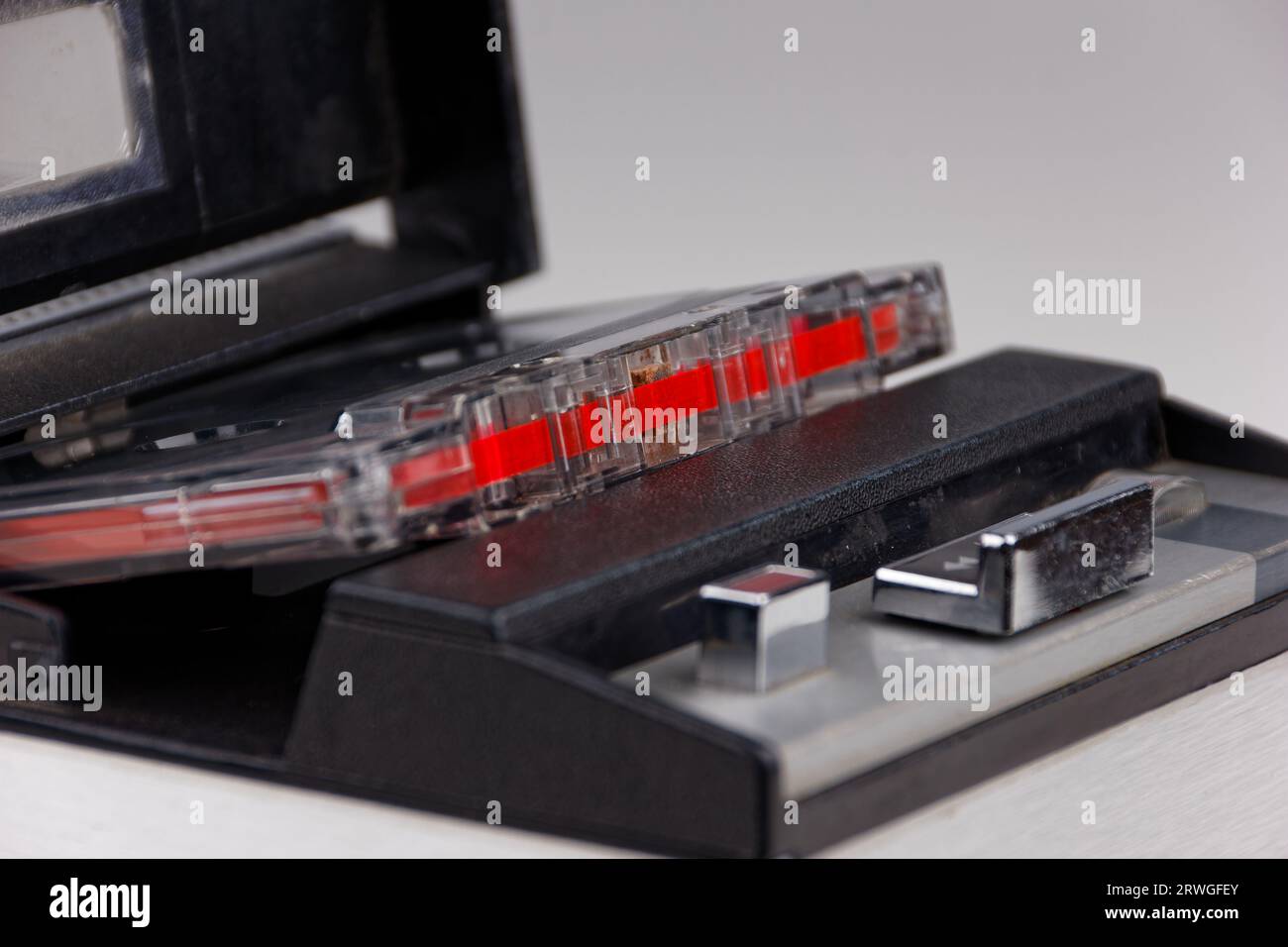 vintage analog audio cassette with transparent case and visible tape ...