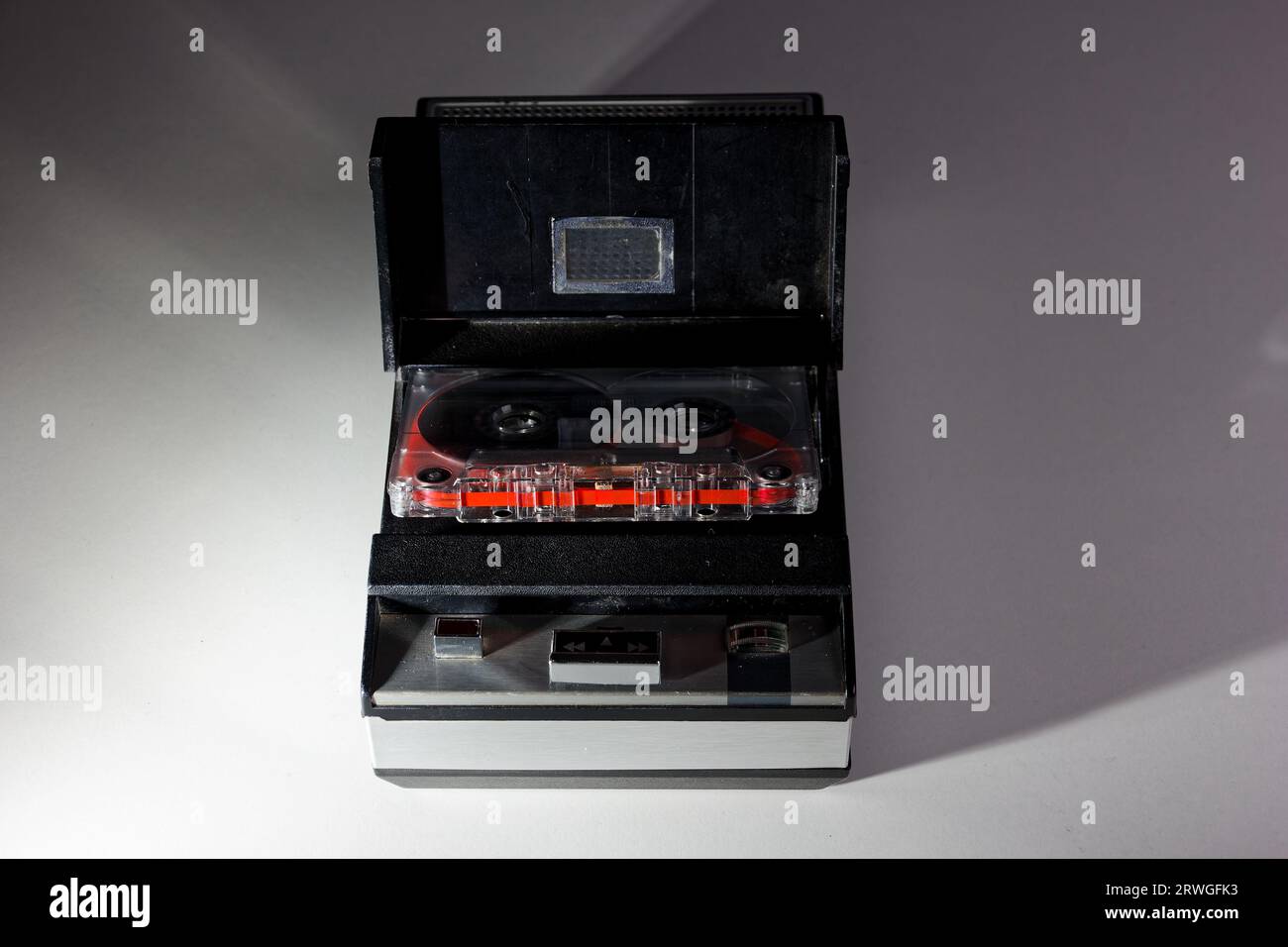 vintage analog audio cassette with transparent case and visible tape ...