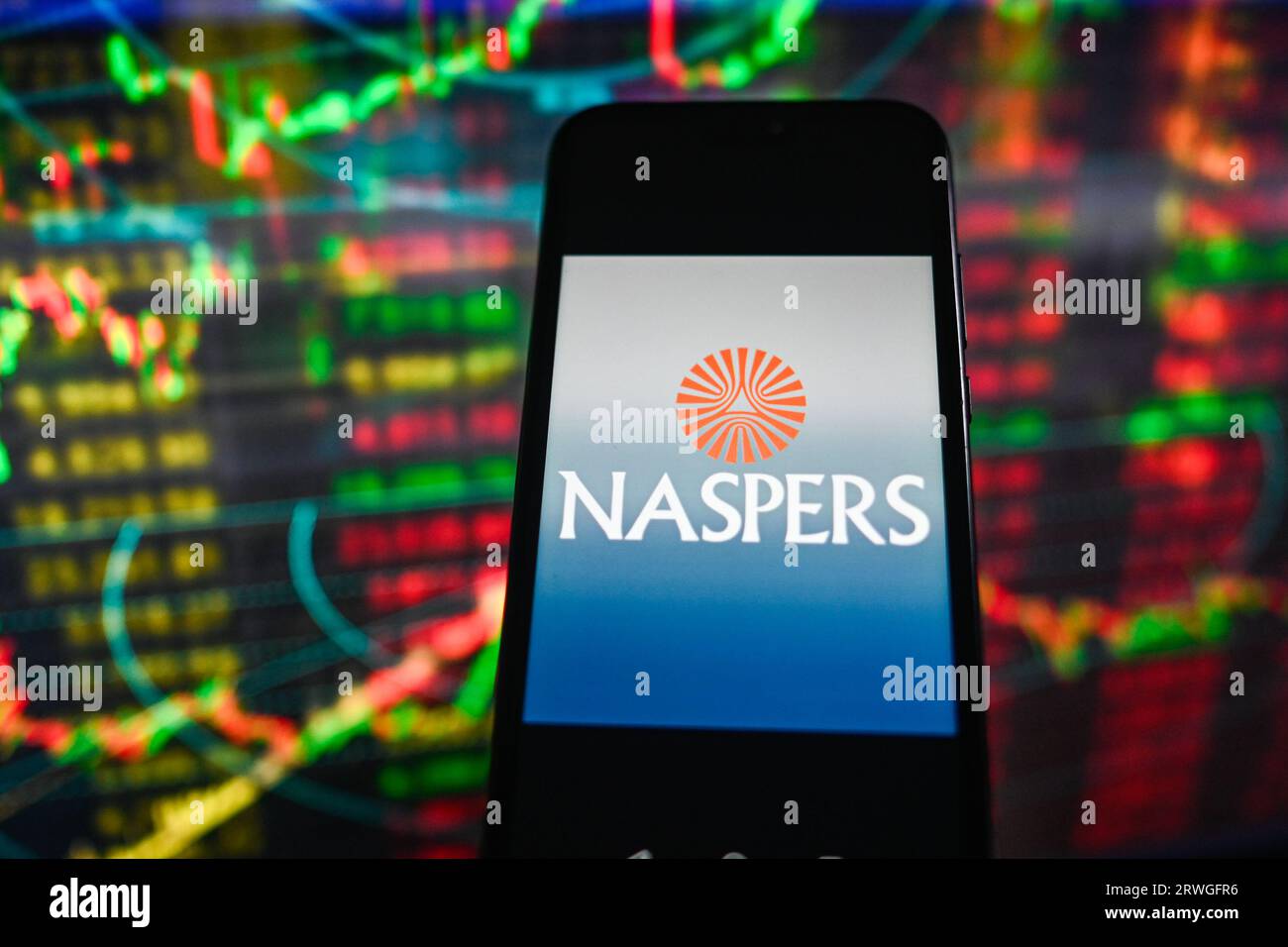 In this photo illustration, a Naspers logo seen displayed on a ...
