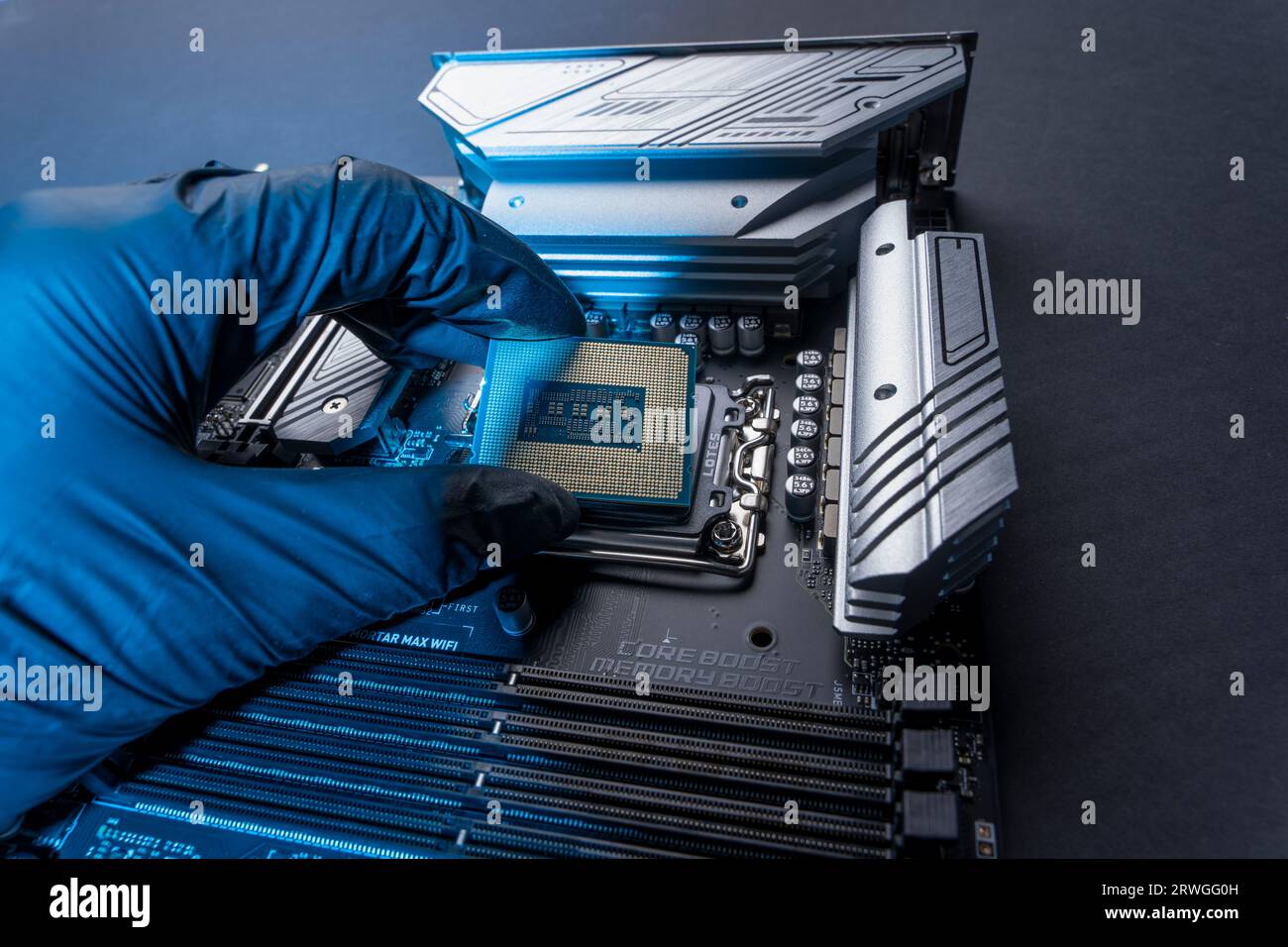 a computer processor in a gloved hand against the background of the ...