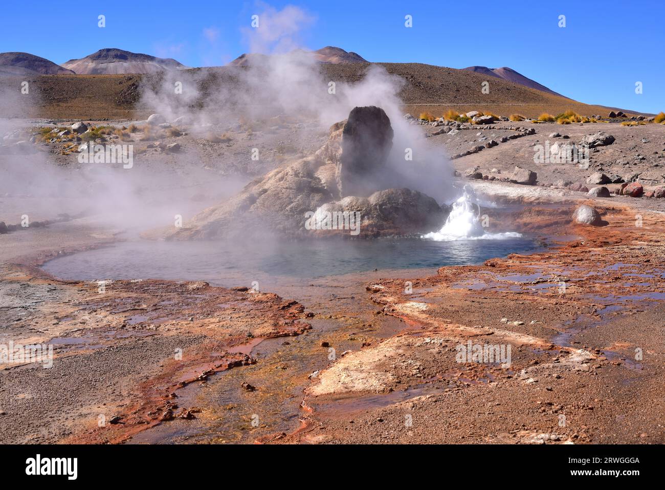 El Tatio Geyser Field. At background, El Tatio volcanic group. San ...