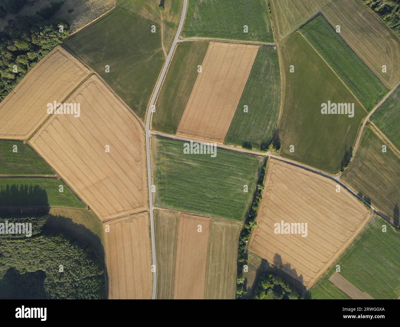 Agriculture fields in the countryside from above in summer Stock Photo - Alamy