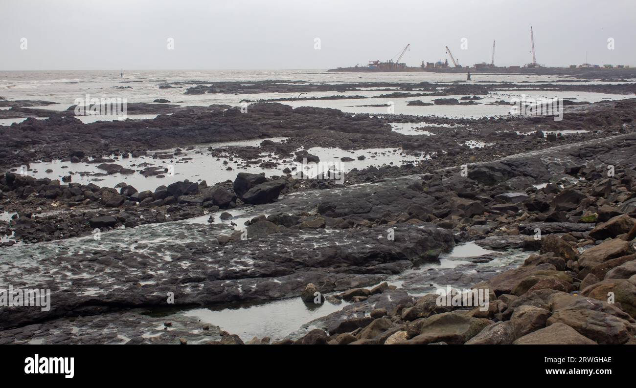 Rocky beach along the Arabian sea coast, Bandstand Promenade in Bandra ...