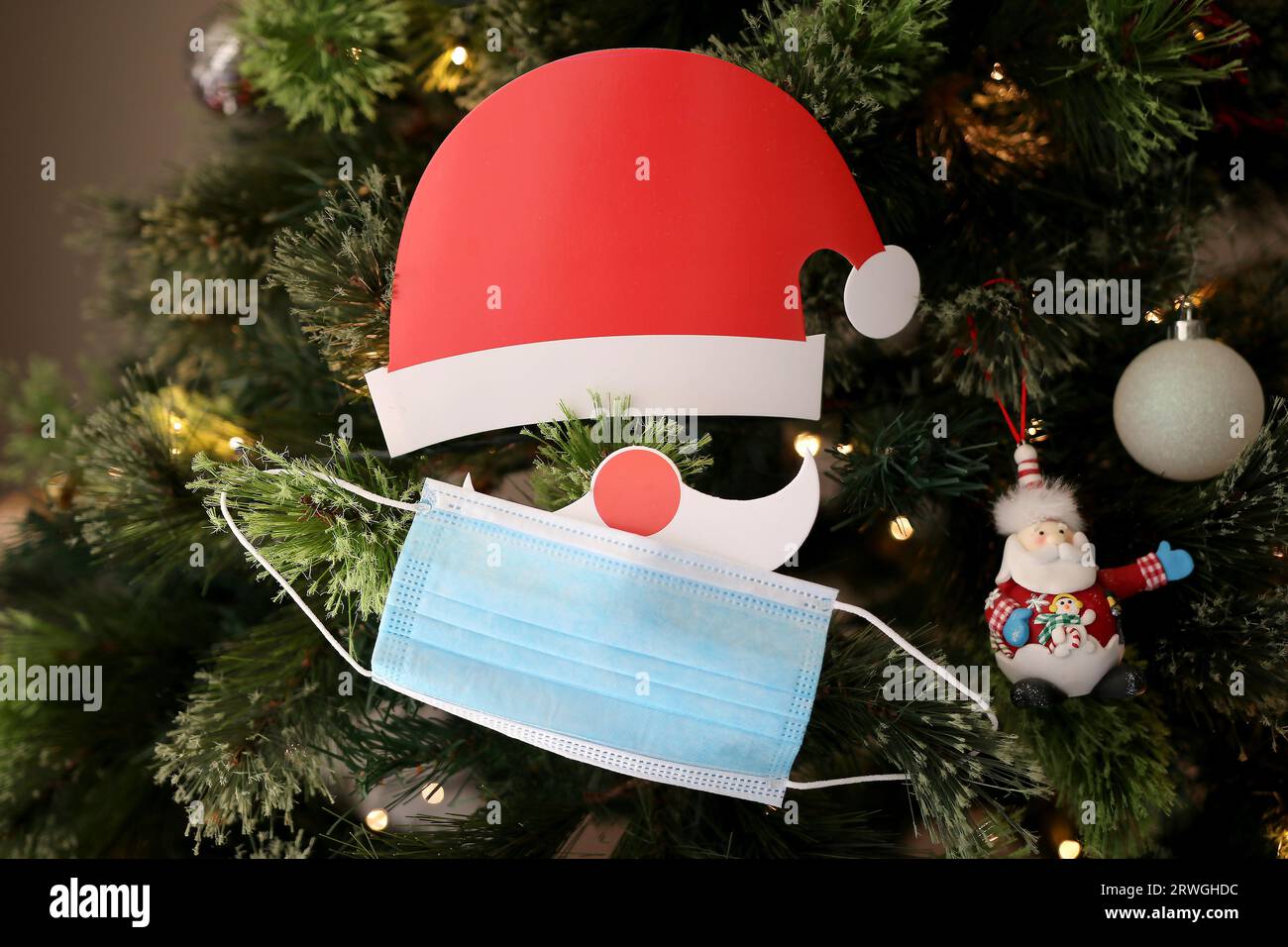 Santa Face Wearing a Face Mask during Covid-19 Pandemic Stock Photo - Alamy