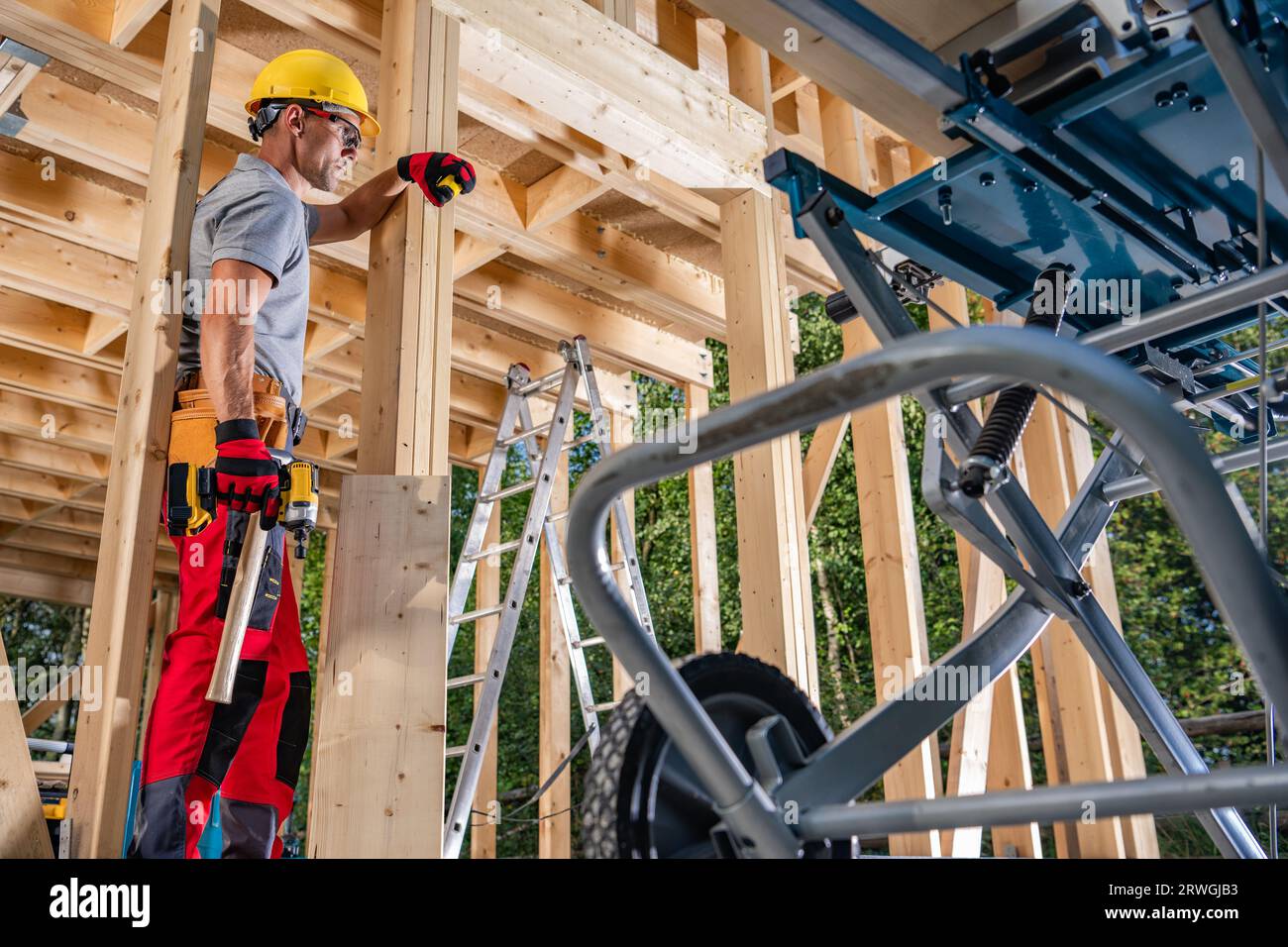 Professional Woodwork Construction Worker in Front of Wood Made House ...
