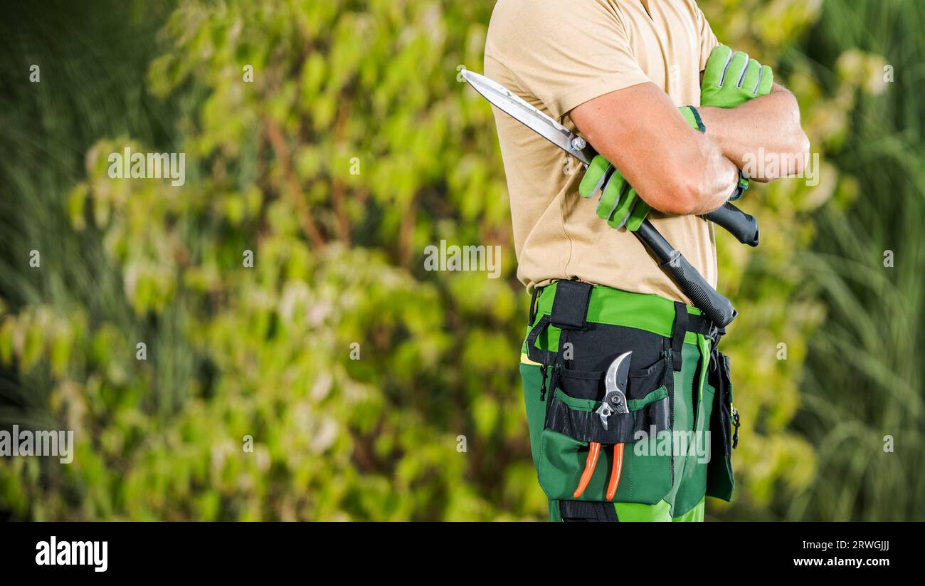 Professional Caucasian Gardener with a Large Hedge Clippers in His ...