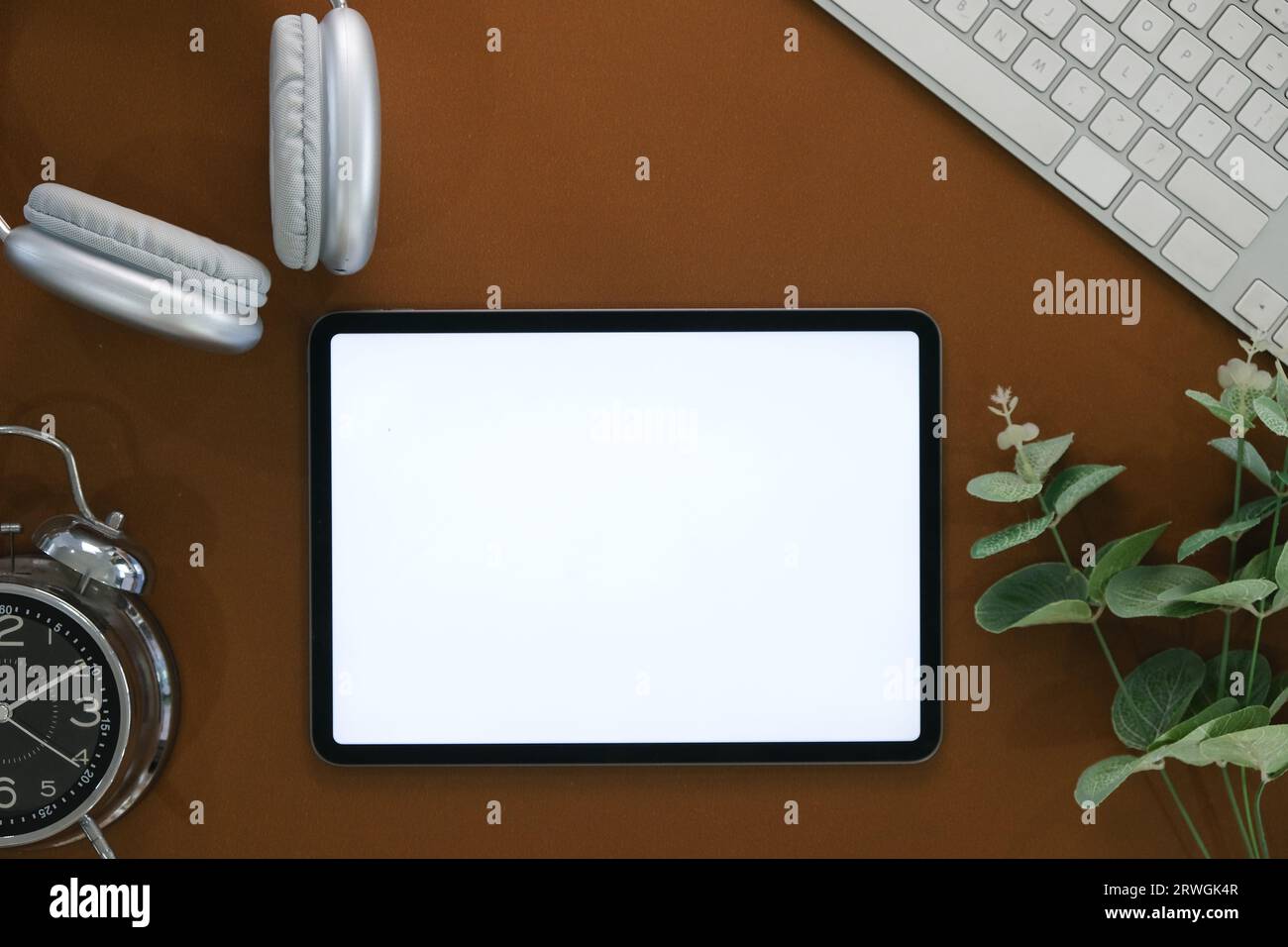 Top view of blank screen tablet on working desk Stock Photo - Alamy
