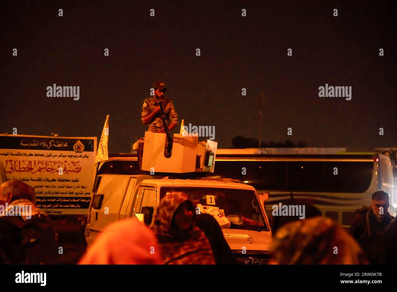 A security trooper stands on guard on top of an armoured vehicle as ...
