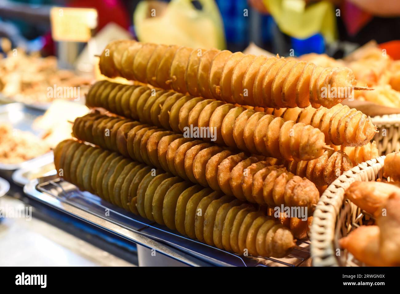 Twisted potatoes in the night market of street food Jalan Alor in ...