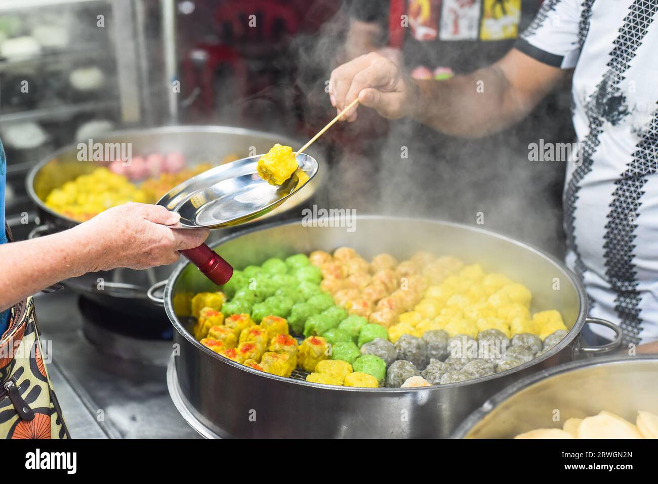 Handmade Dim Sum with different fillings in Jalan Alor street food in ...