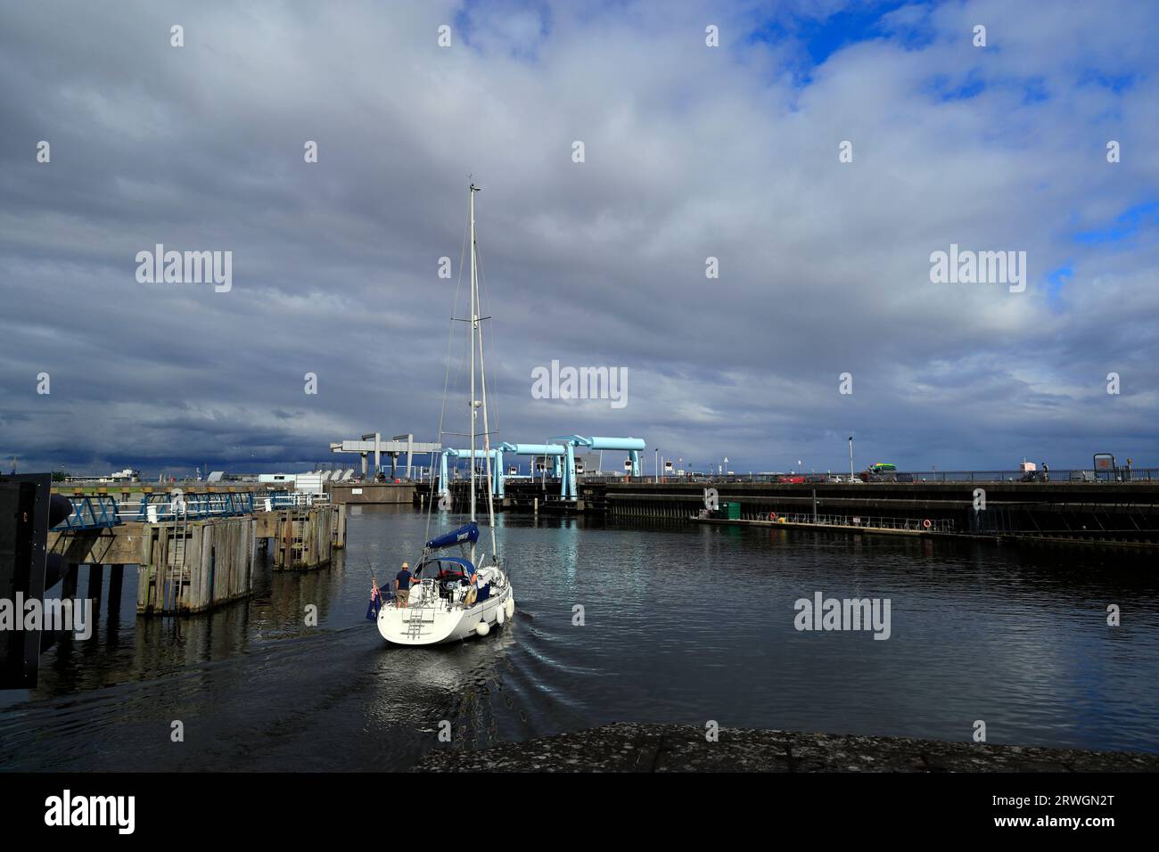 Yacht approaching sea lock on Cardiff Bay Barrage, South Wales, UK ...