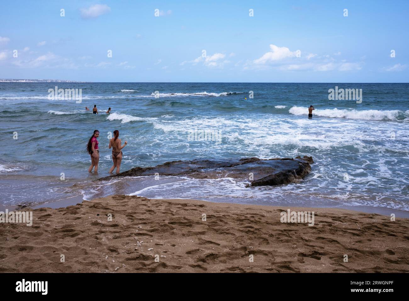 People swimming, North coast of Crete, Greece Stock Photo - Alamy