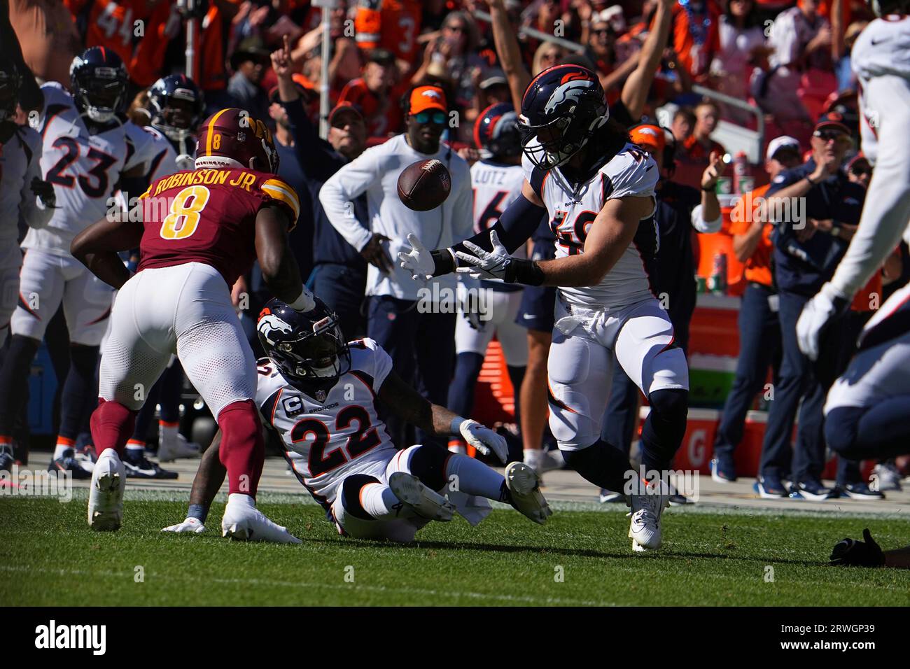 Denver Broncos linebacker Alex Singleton (49) tips the ball against the ...