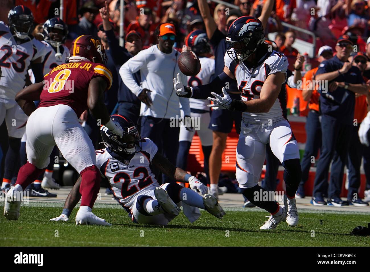 Denver Broncos linebacker Alex Singleton (49) tips the ball against the ...