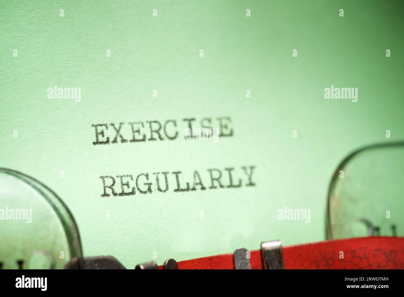 Exercise regularly text written with a typewriter Stock Photo - Alamy