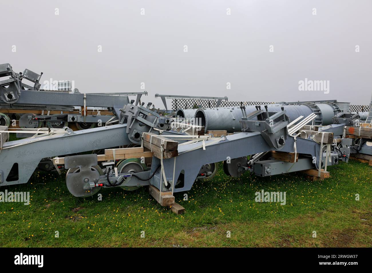 Material for the new construction of a cable car lies on a meadow Stock ...