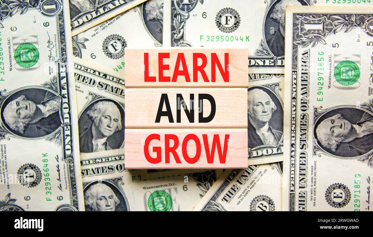 Learn and grow symbol. Concept word Learn And Grow on beautiful wooden ...