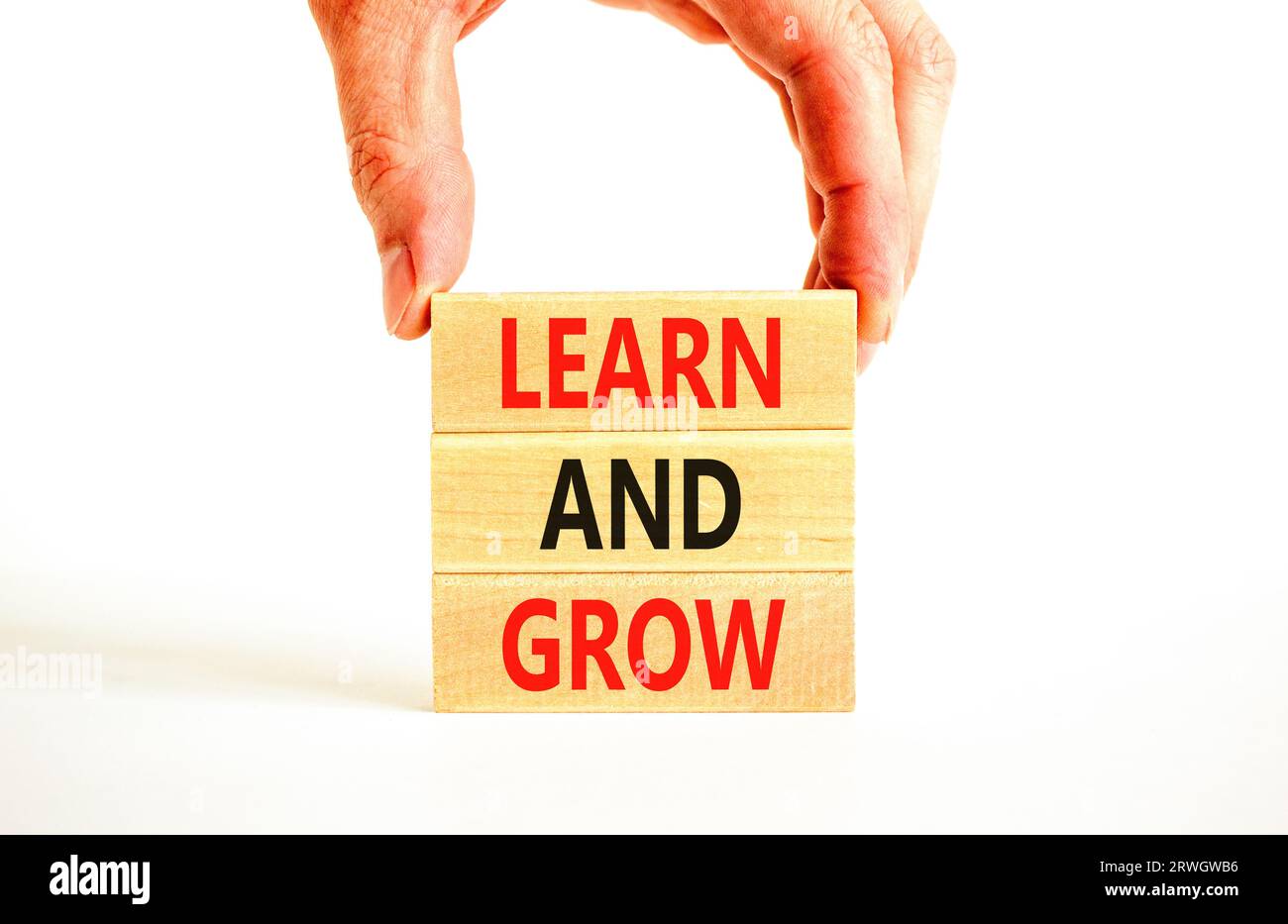 Learn and grow symbol. Concept word Learn And Grow on beautiful wooden ...