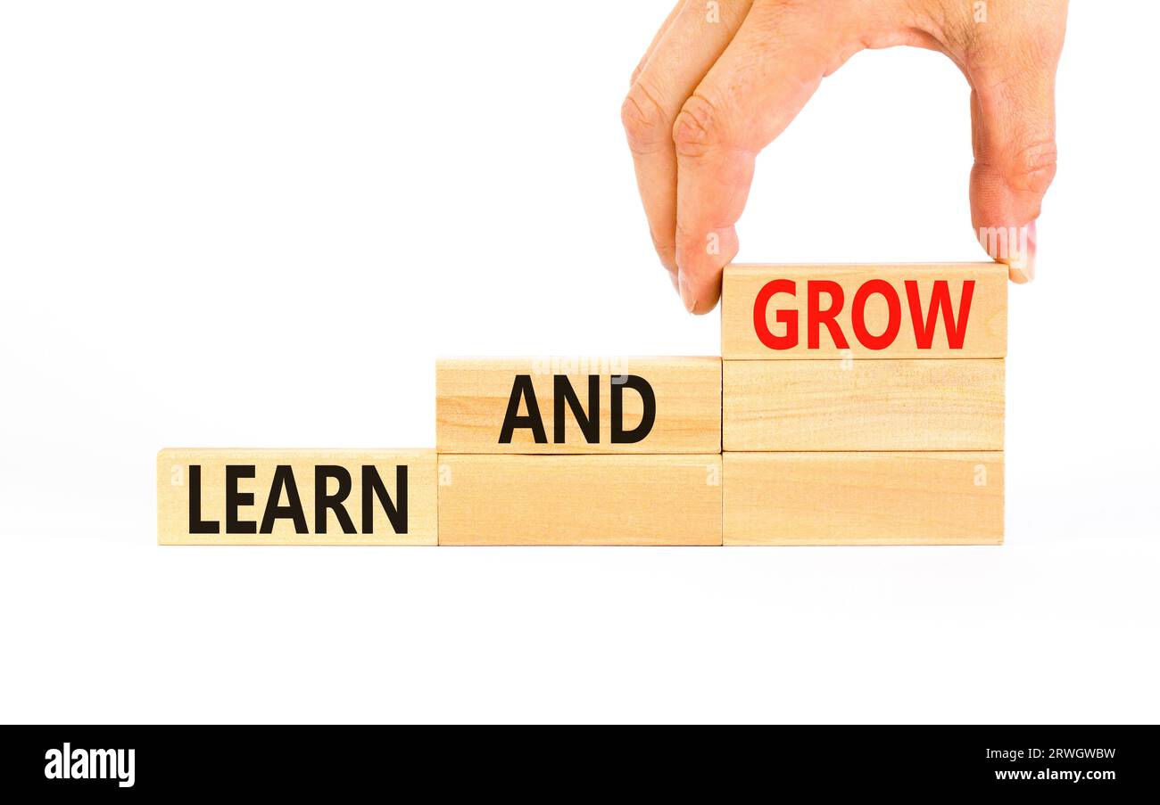 Learn and grow symbol. Concept word Learn And Grow on beautiful wooden ...