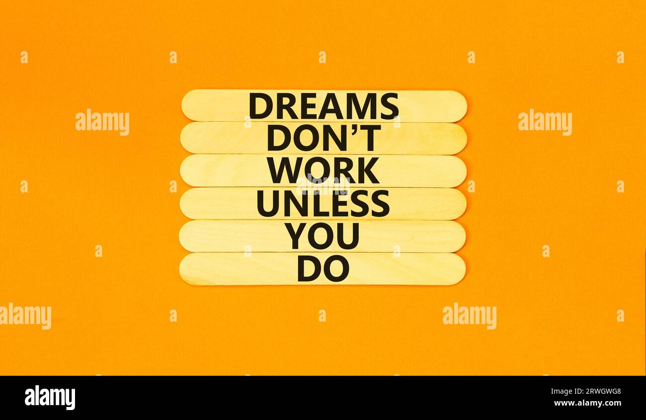 Dream and do symbol. Wooden blocks with words Dreams do not work unless ...