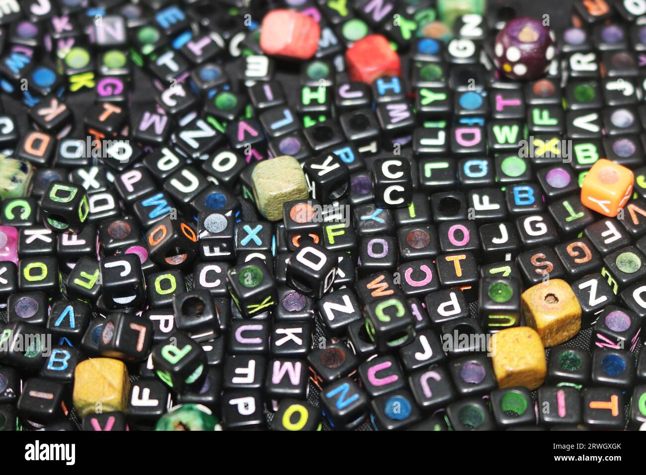 plastic black color dice, cubes with English alphabet letters image ...
