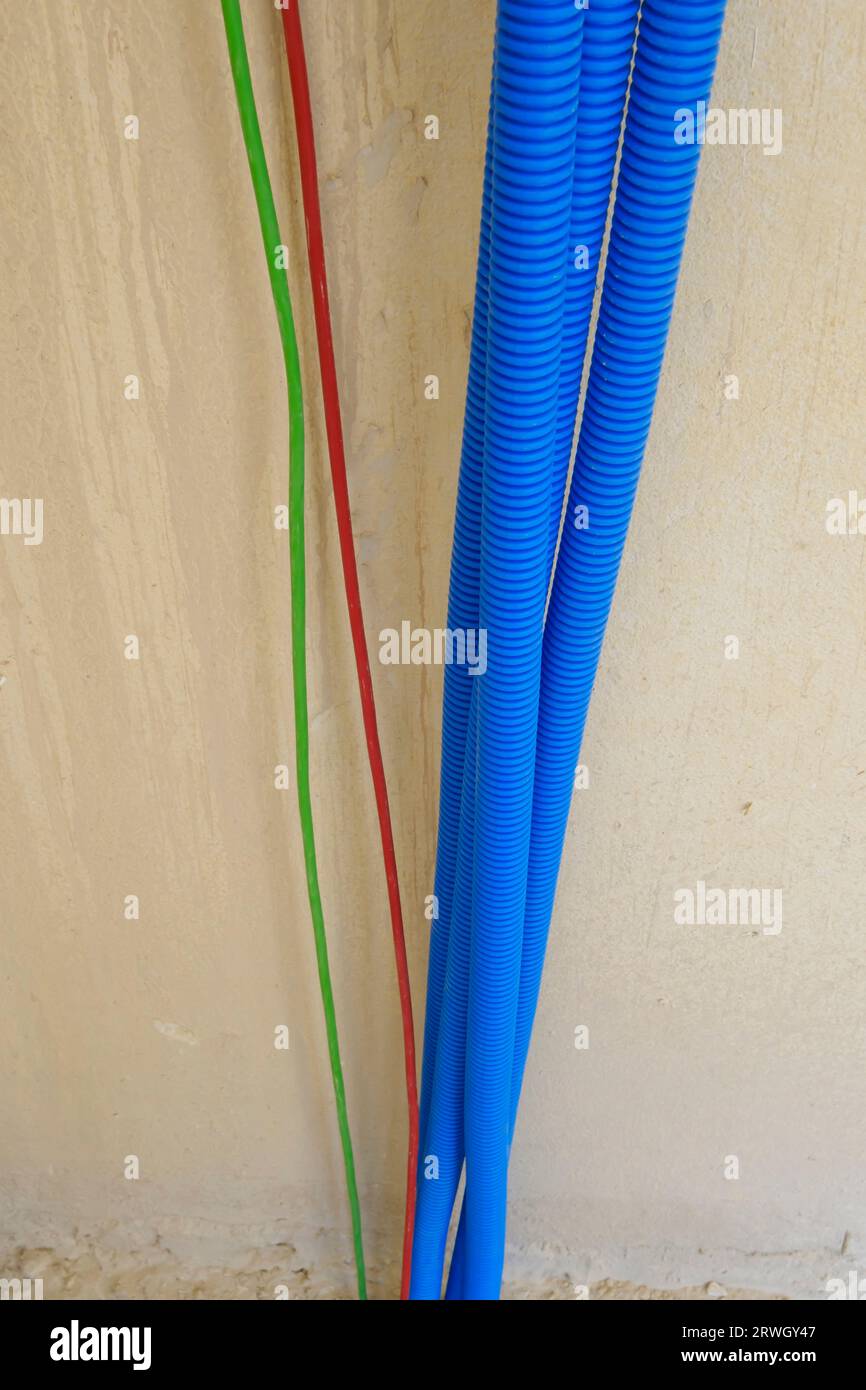 Network Cables And Conduits On A Wall, Construction Site, Renovation Of ...