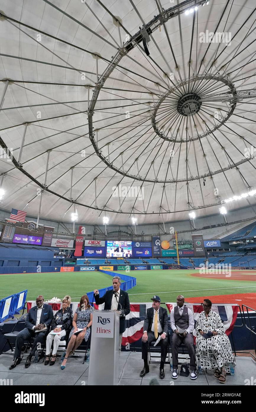 Tampa Bay Rays owner Stuart Sternberg, center, behind podium, speaks to ...