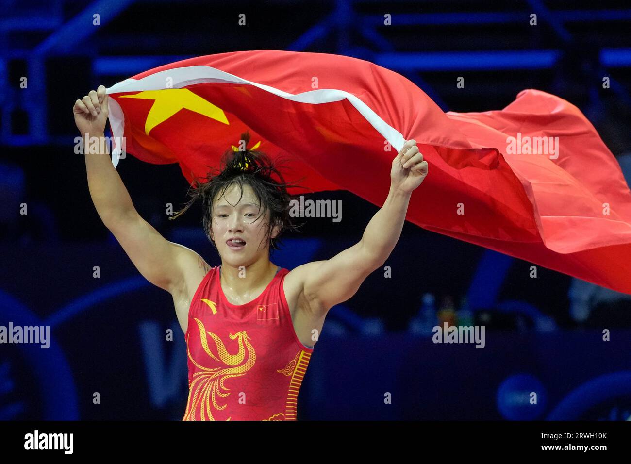 Qi Zhang of China celebrates defeating Yuliia Tkach of Ukraine and ...