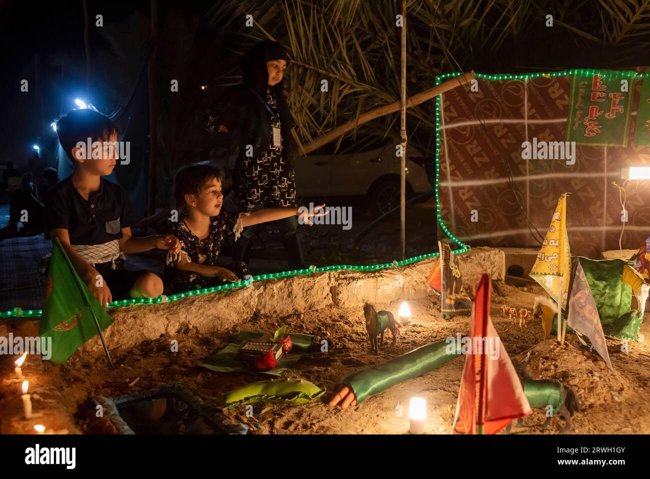 A Kid sit In front of a graves symbolizing the graves of Martyrs of ...