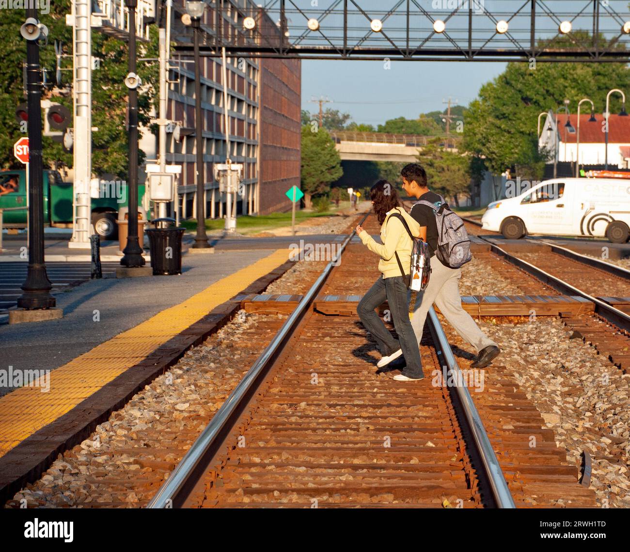 Students walking to school crossing the railroad tracks at Gaithersburg Railway Station ...