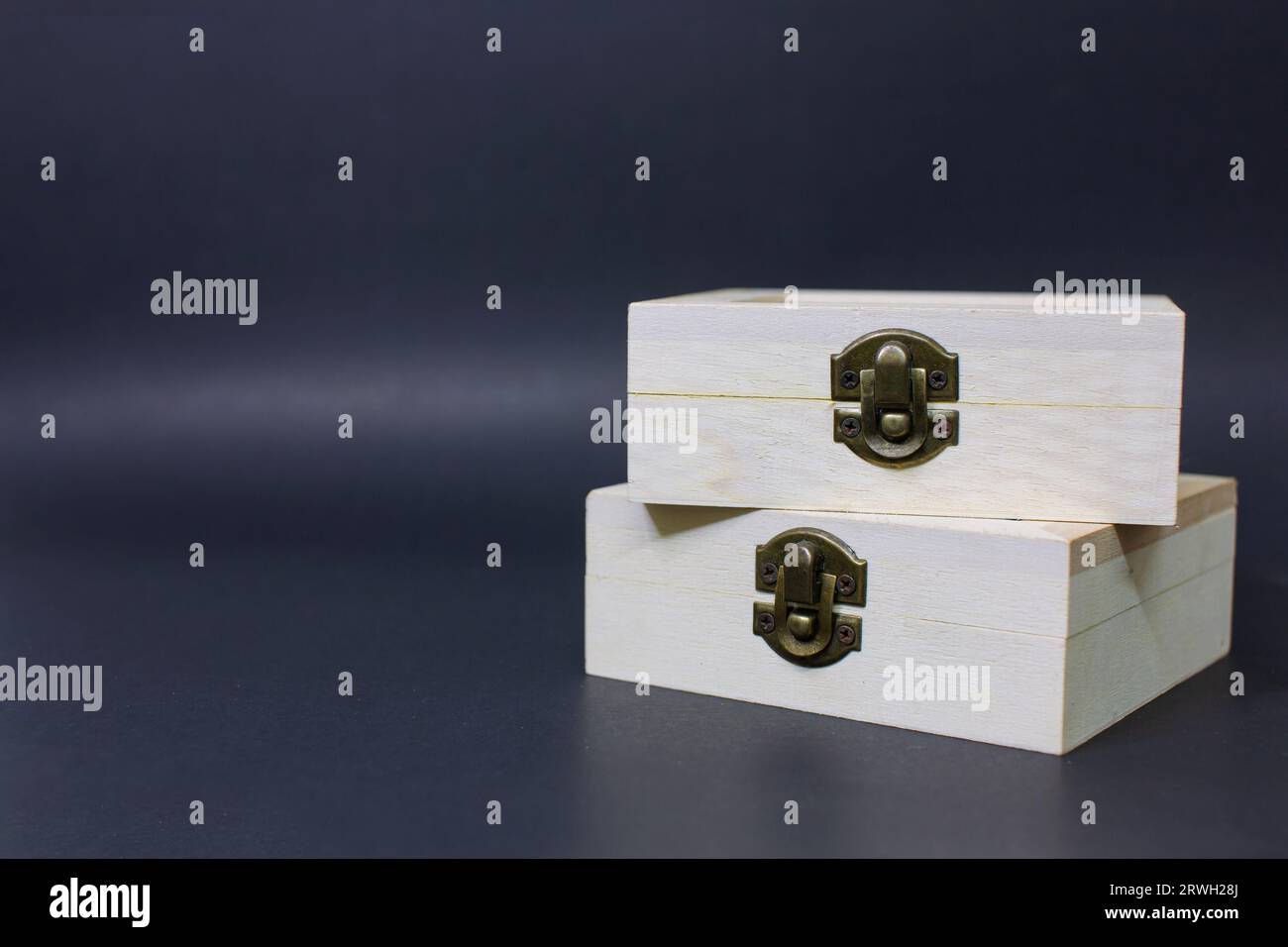 Empty small light brown wooden box Container objects are locked with ...