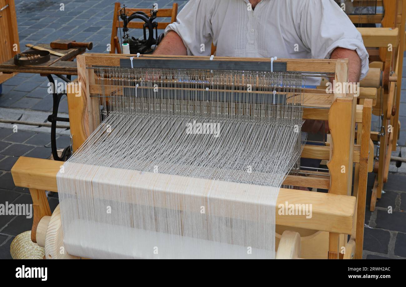 Ancient spinning frame to weave cotton and wool threads Stock Photo - Alamy