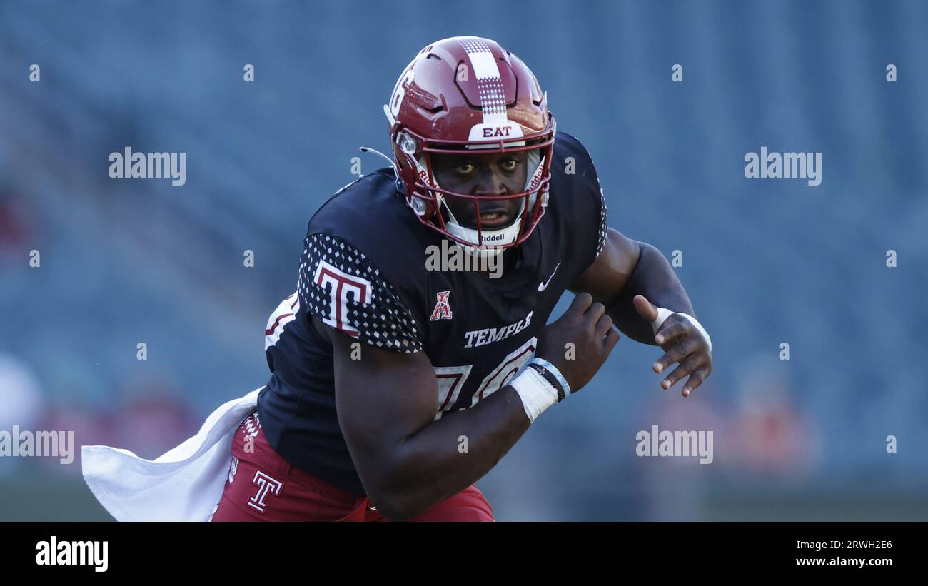 Temple quarterback Quincy Patterson runs after handing the ball off ...