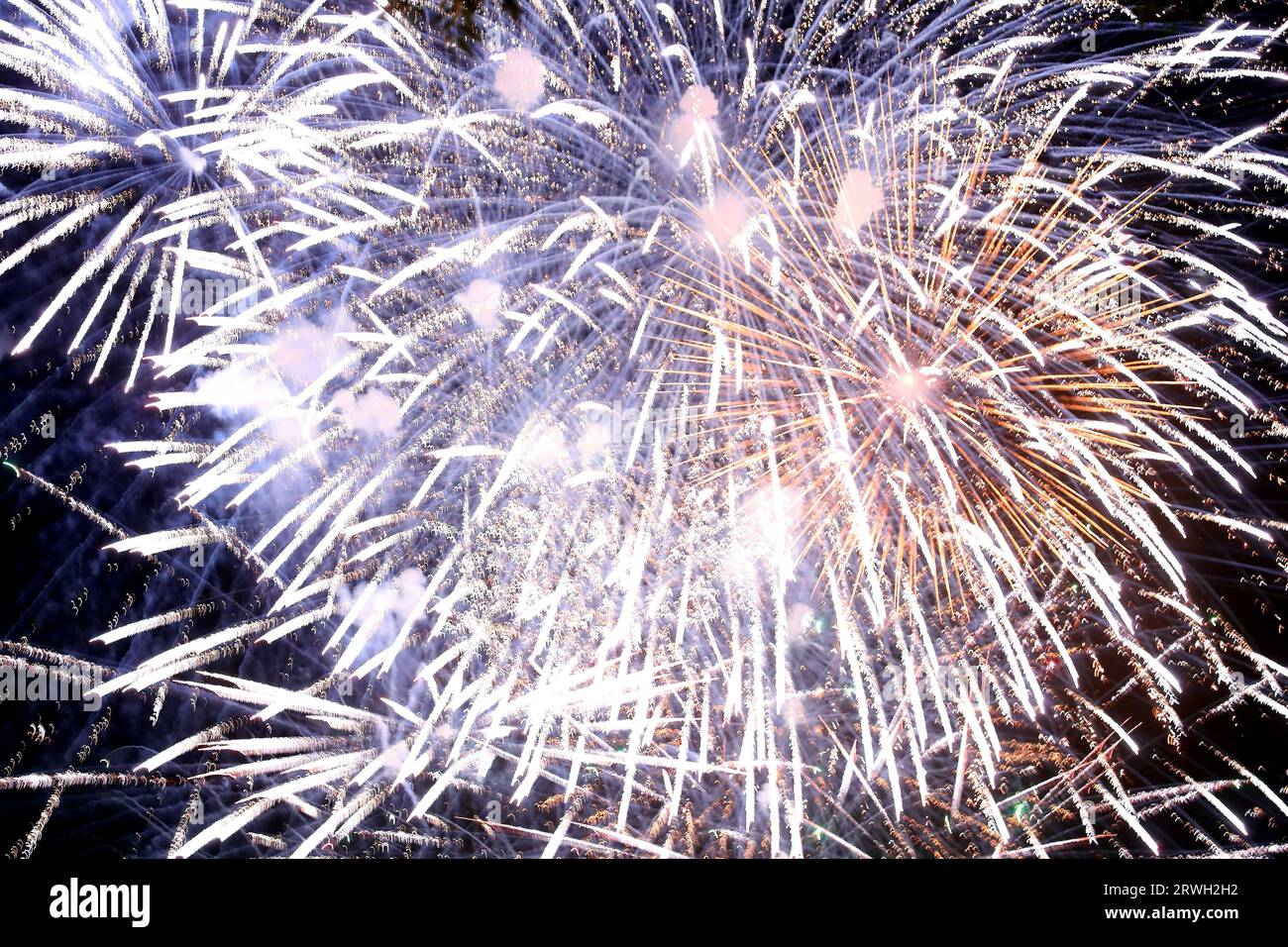 many sparkling glittering fireworks exploded in the sky during the ...