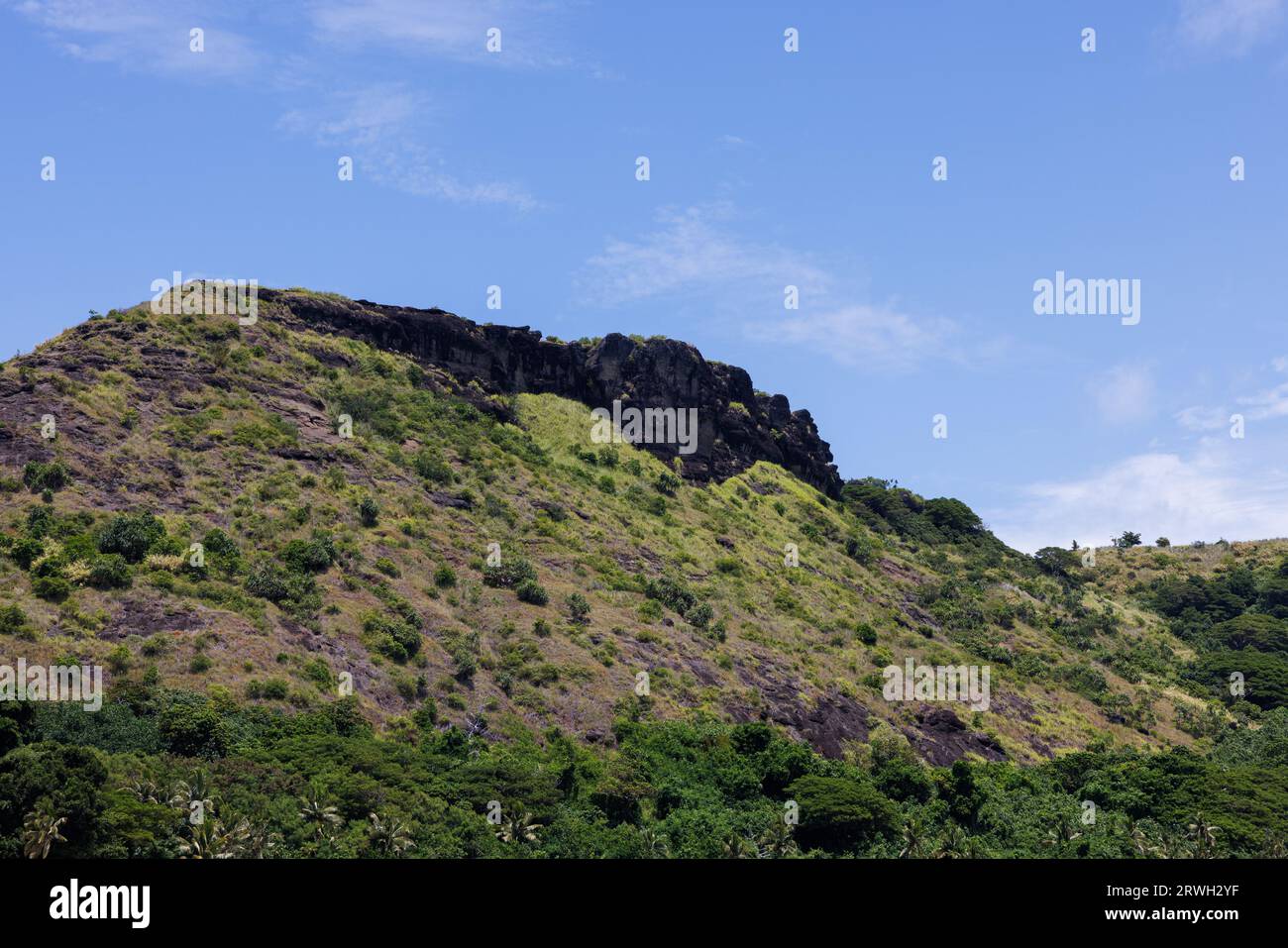 fiji volcanic mountain under blue sky Stock Photo - Alamy