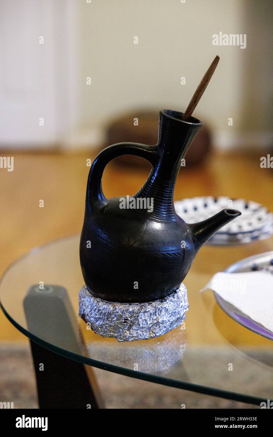 Ethiopian coffee pot sitting on a glass table Stock Photo - Alamy