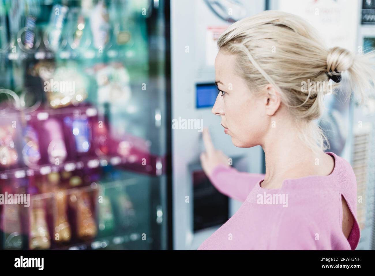 Woman chocolate vending machine hi-res stock photography and images - Alamy