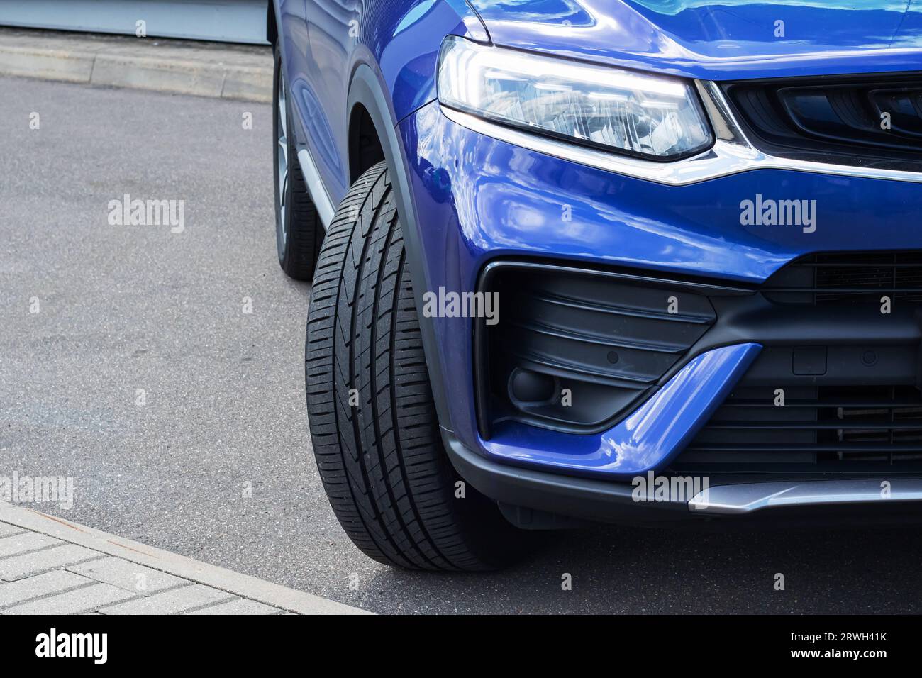 The front wheel and headlight of the car close up Stock Photo - Alamy