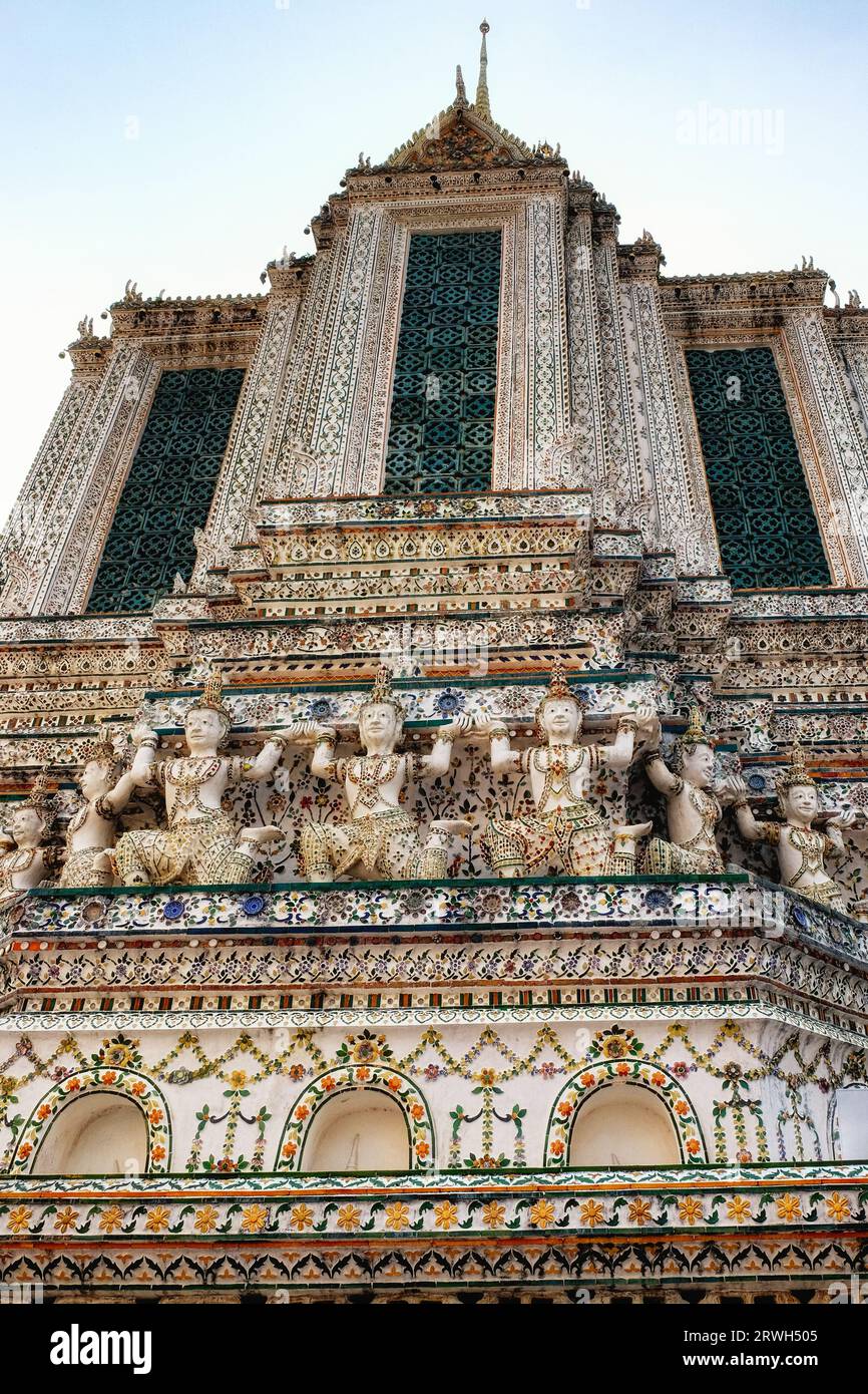 A temple in Thailand with intricate details and a tall spire. The ...