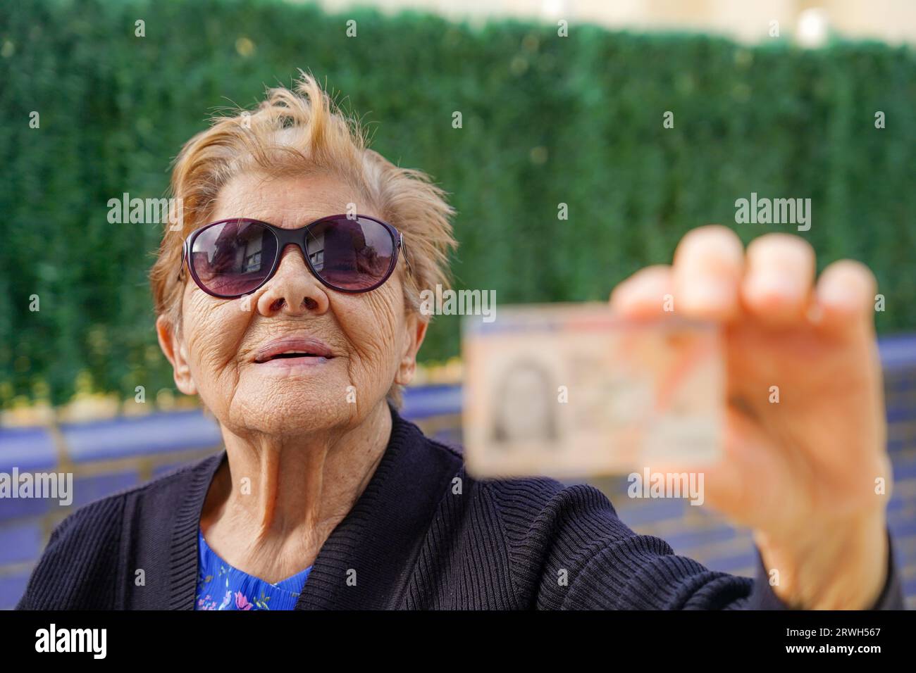 old woman showing her personal identification. Personal information ...