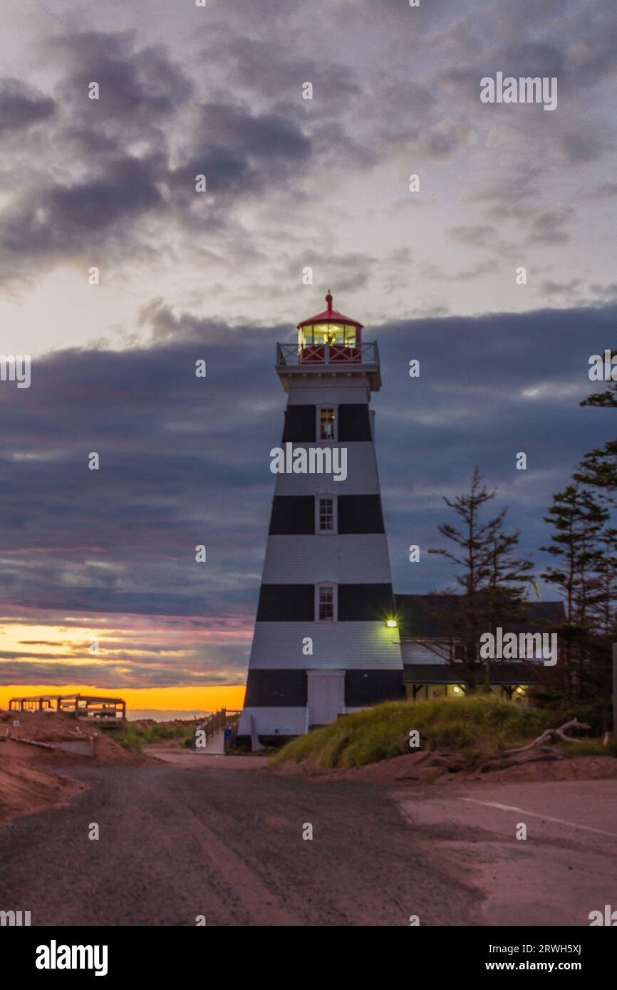 West Point lighthouse, Prince Edward Island, PEI, Canada, at sunset in ...