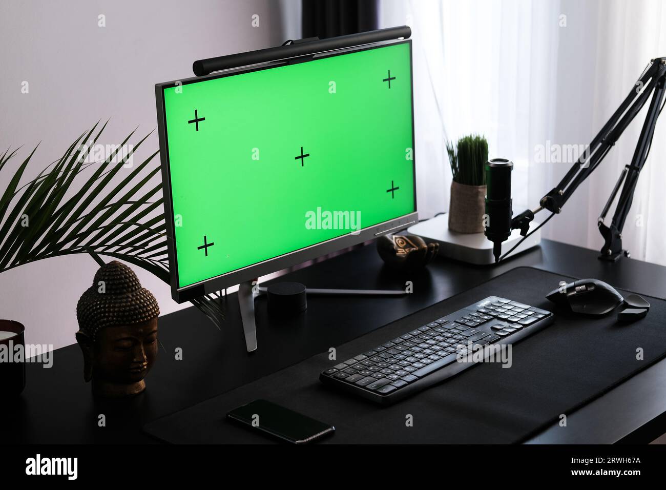 Workspace, monitor with chromakey. Green monitor screen in a apartment ...